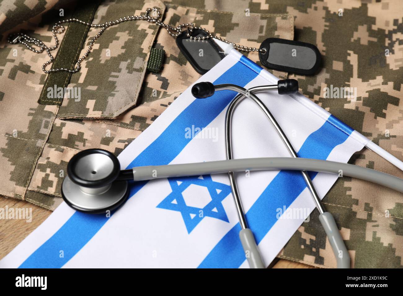 Stethoscope, flag of Israel, tags and military uniform on table ...