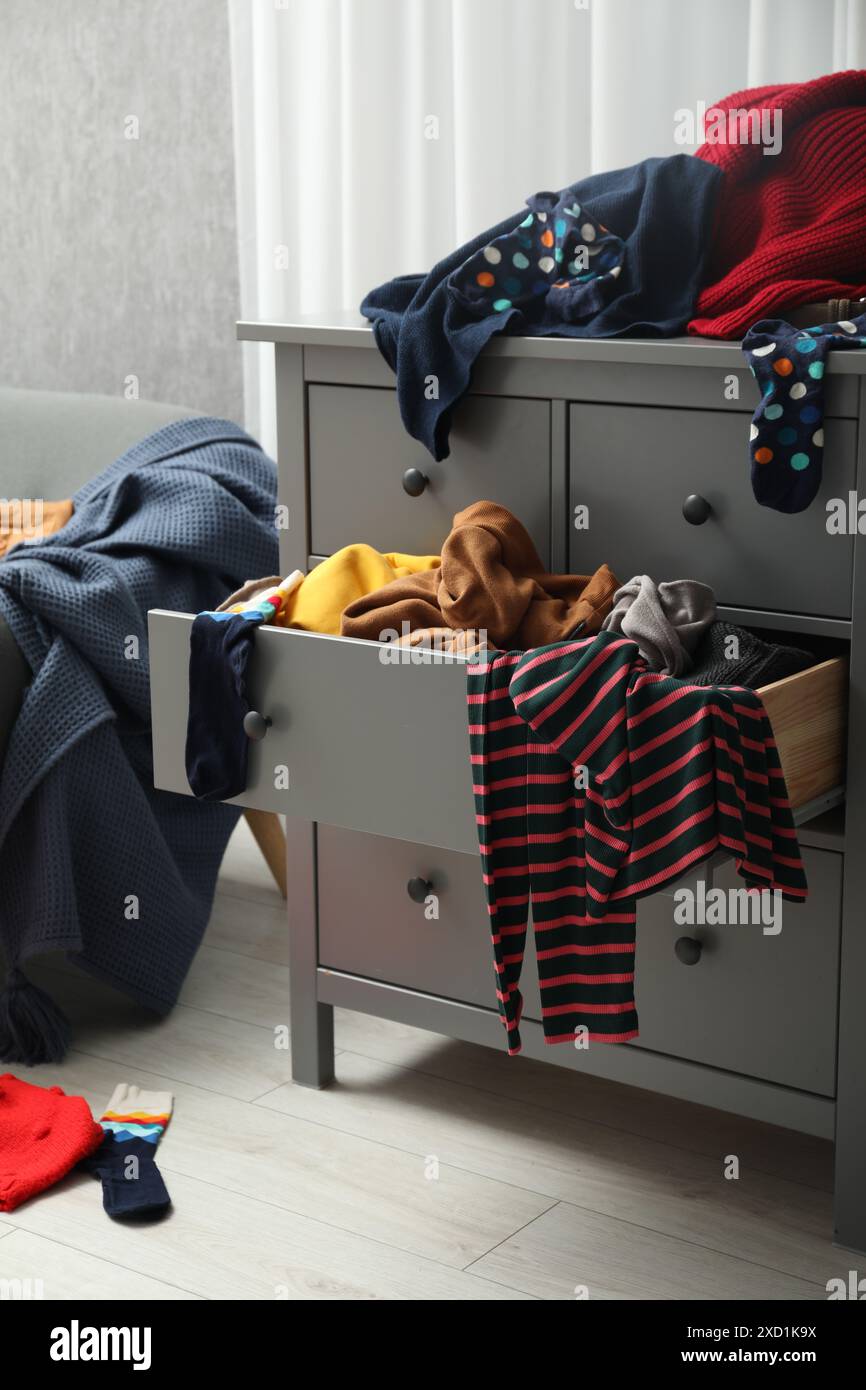 Cluttered room. Clothes in mess all around place Stock Photo - Alamy