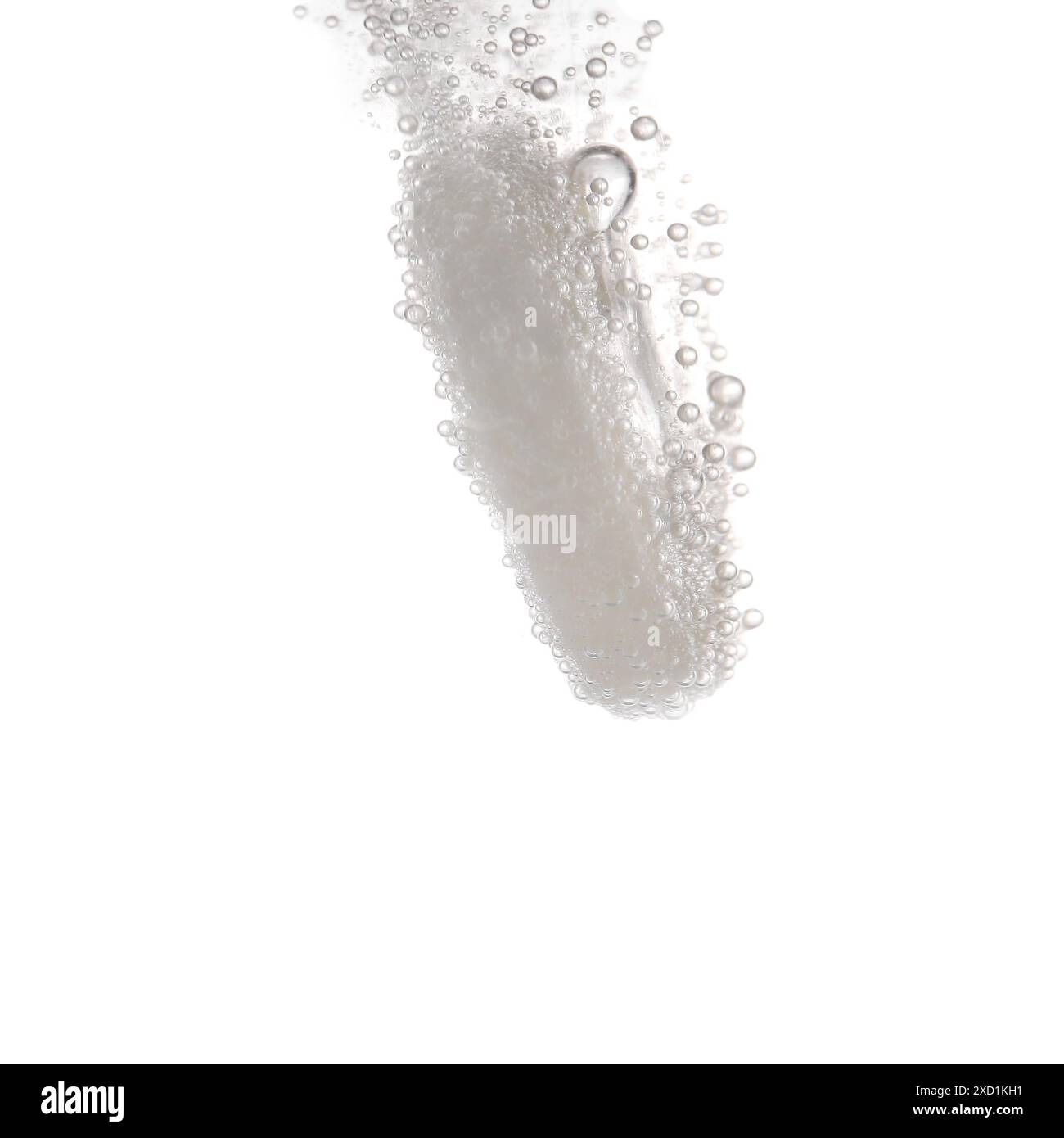 Effervescent pill dissolving in water on white background, closeup ...