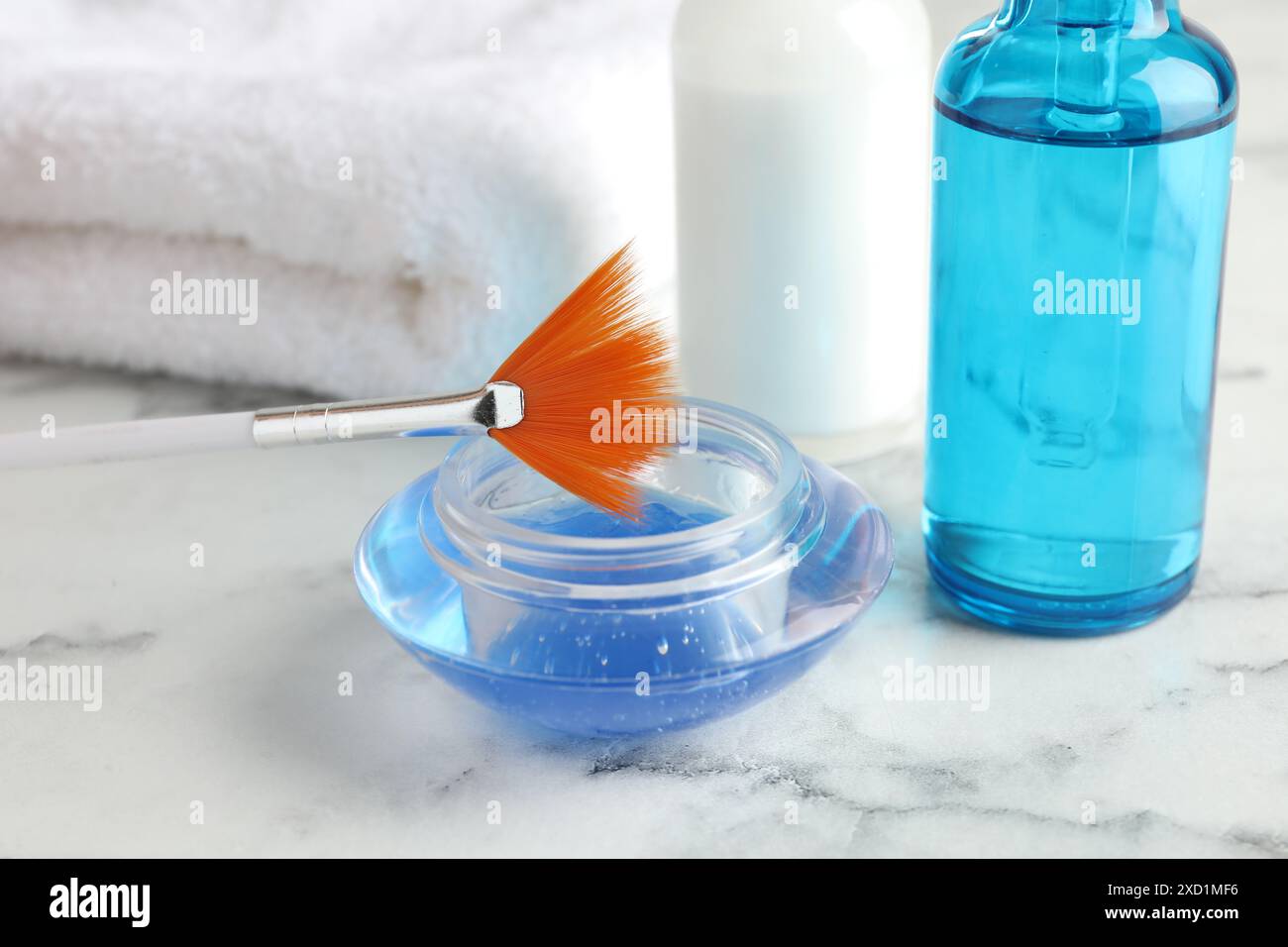 Chemical peel in bowl and brush on white marble table, closeup. Peeling ...