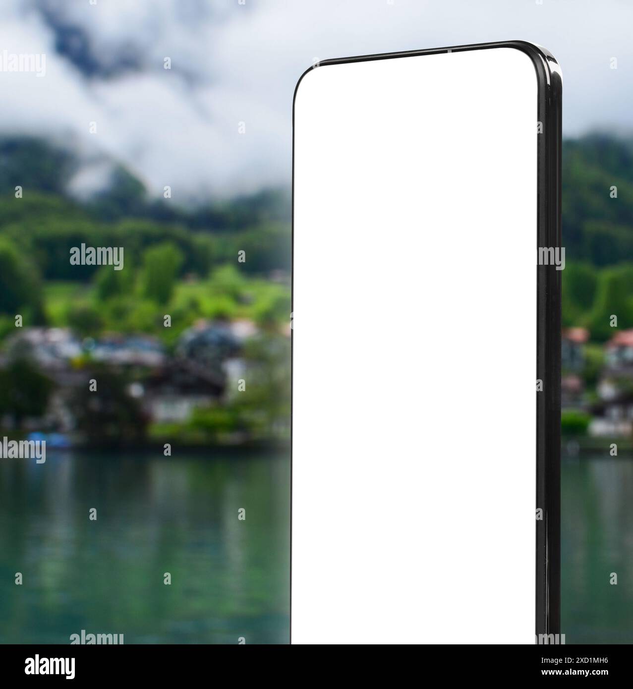 Mobile phone with empty screen against beautiful landscape. Space for ...