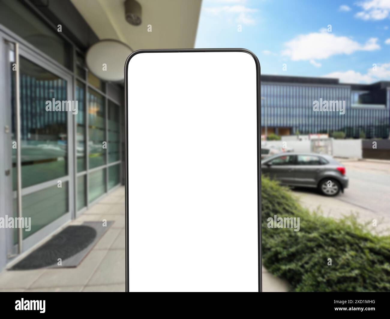 Mobile phone with empty screen against city street. Space for design ...