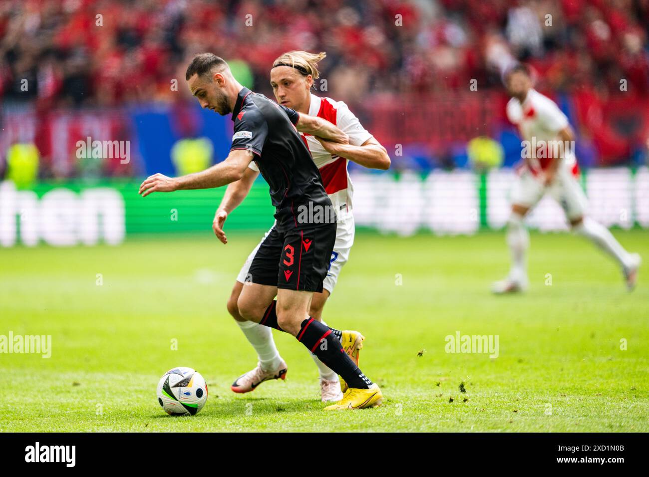 Hamburg, Germany. 19th, June 2024. Mario Mitaj (3) of Albania and Lovro ...