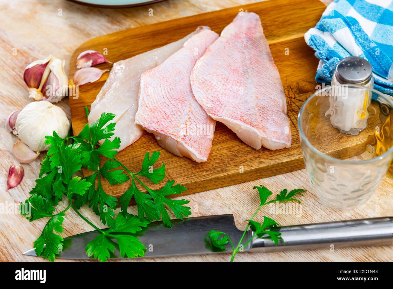 Raw rockfish fillet with condiments, food preparation Stock Photo - Alamy