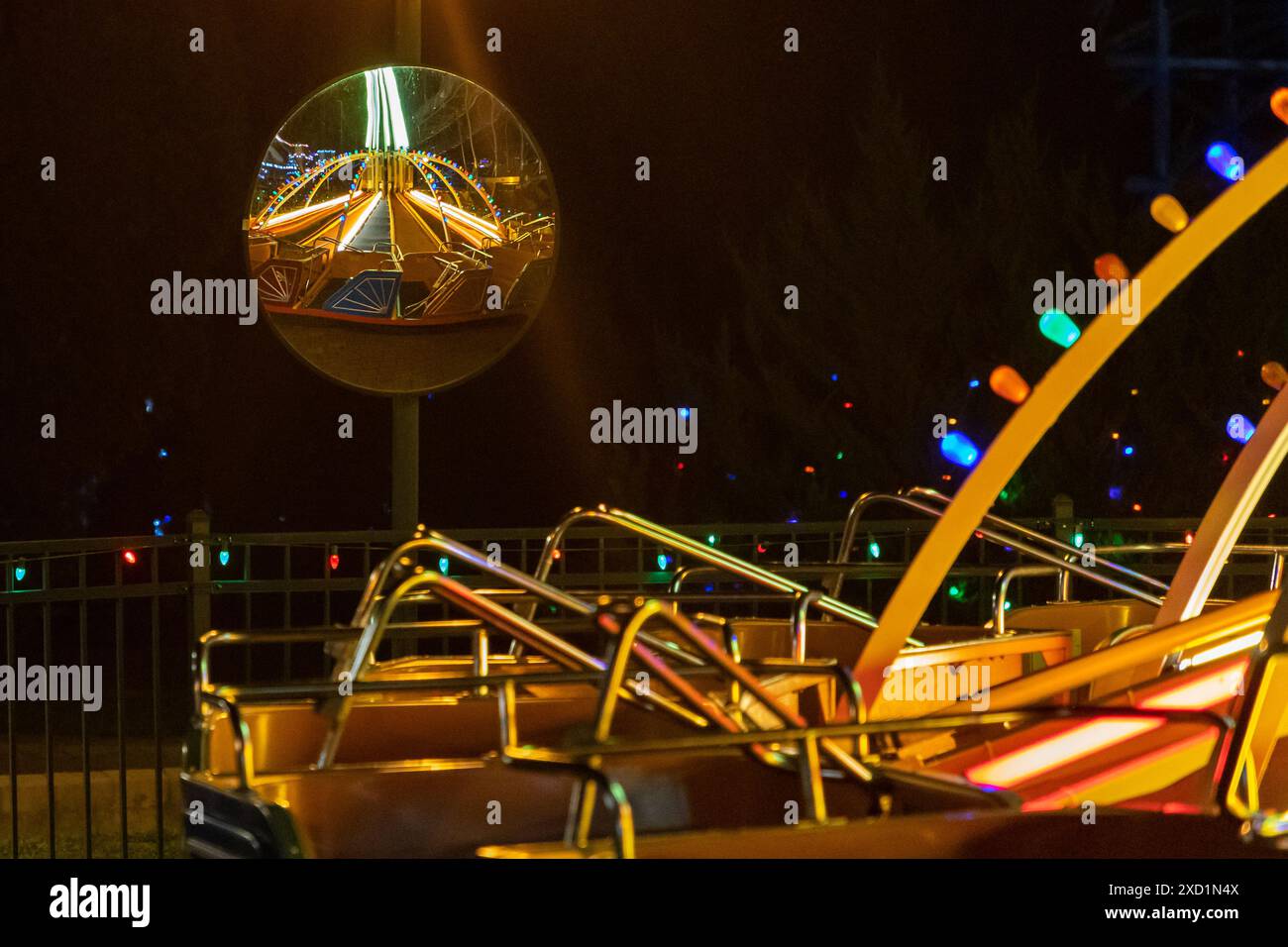 Mirror Reflection of Carnival Ride at Christmas time Stock Photo - Alamy