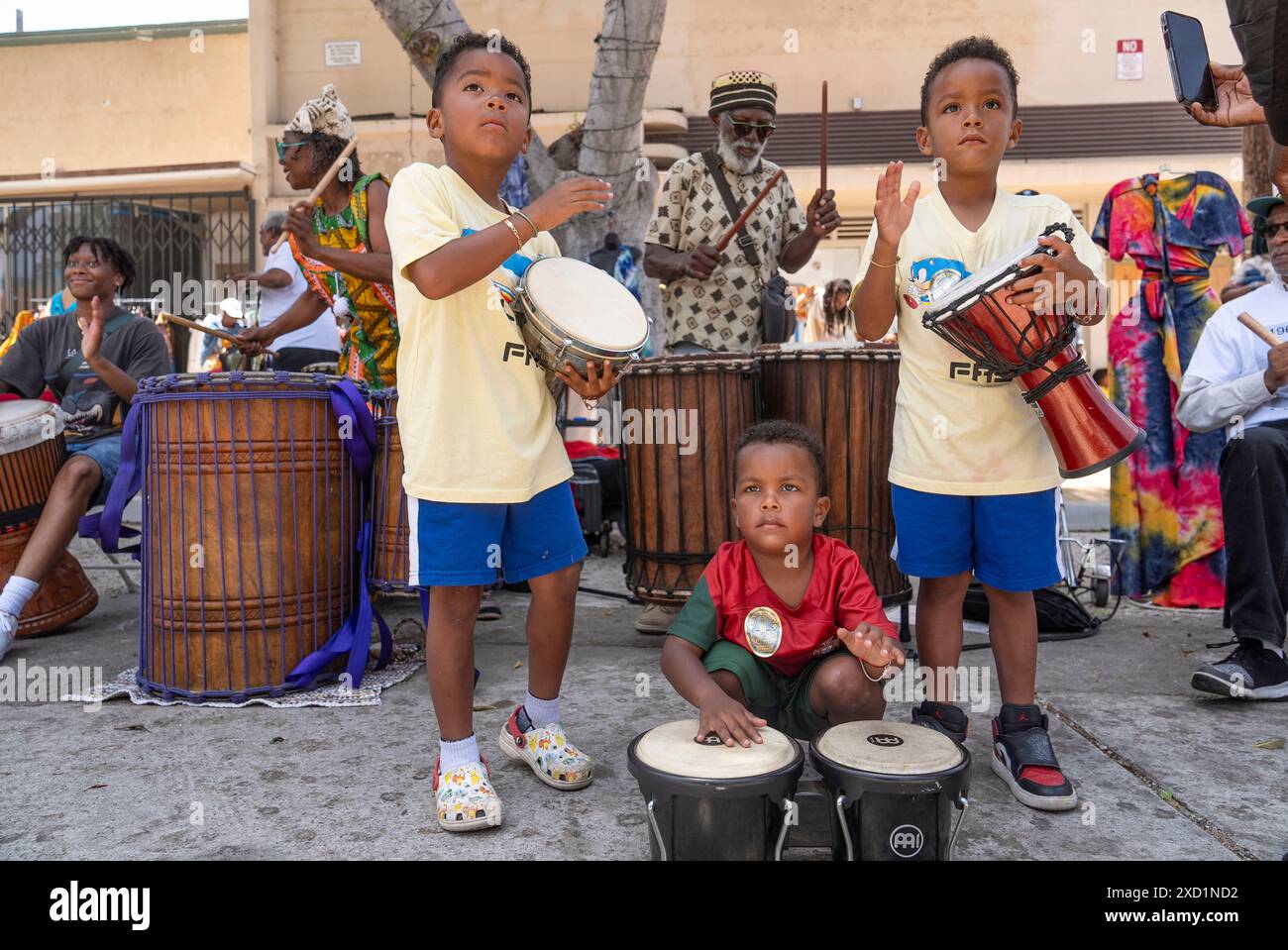 Brothers, Napier Johnson, 5, left, and Kao Johnson, 5, right, and Micah Johnson, 4, middle, play ...