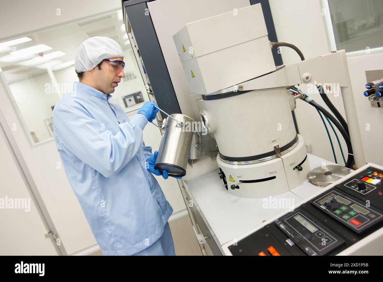 Pouring liquid nitrogen to improve the vacuum in the chamber to deposit ...