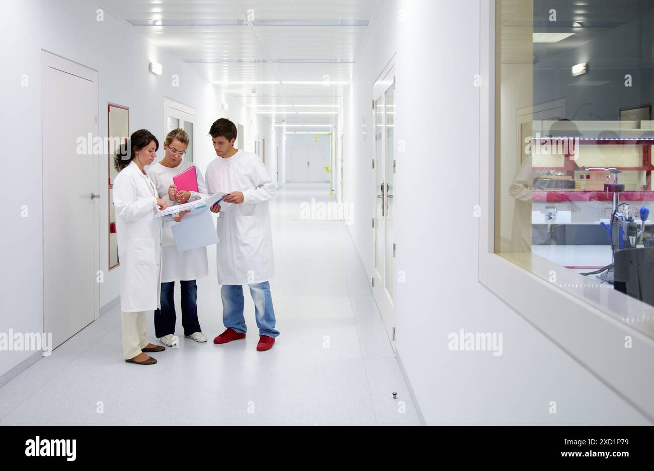 Teacher and students in hallway BioMEMS laboratory Research of surface chemistry and biological ...