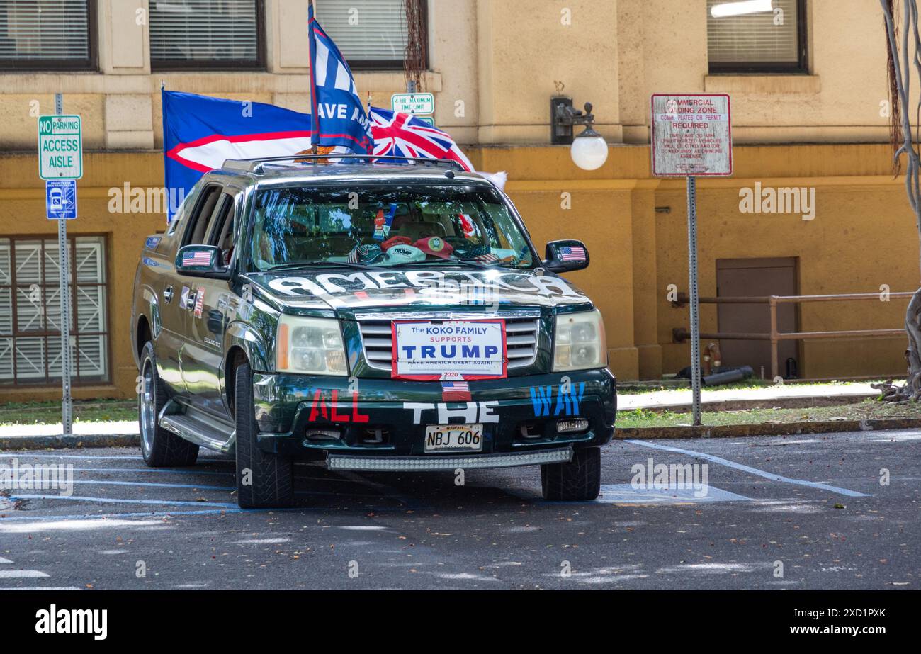 A pickup truck adorned with an array of Donald Trump support signs ...