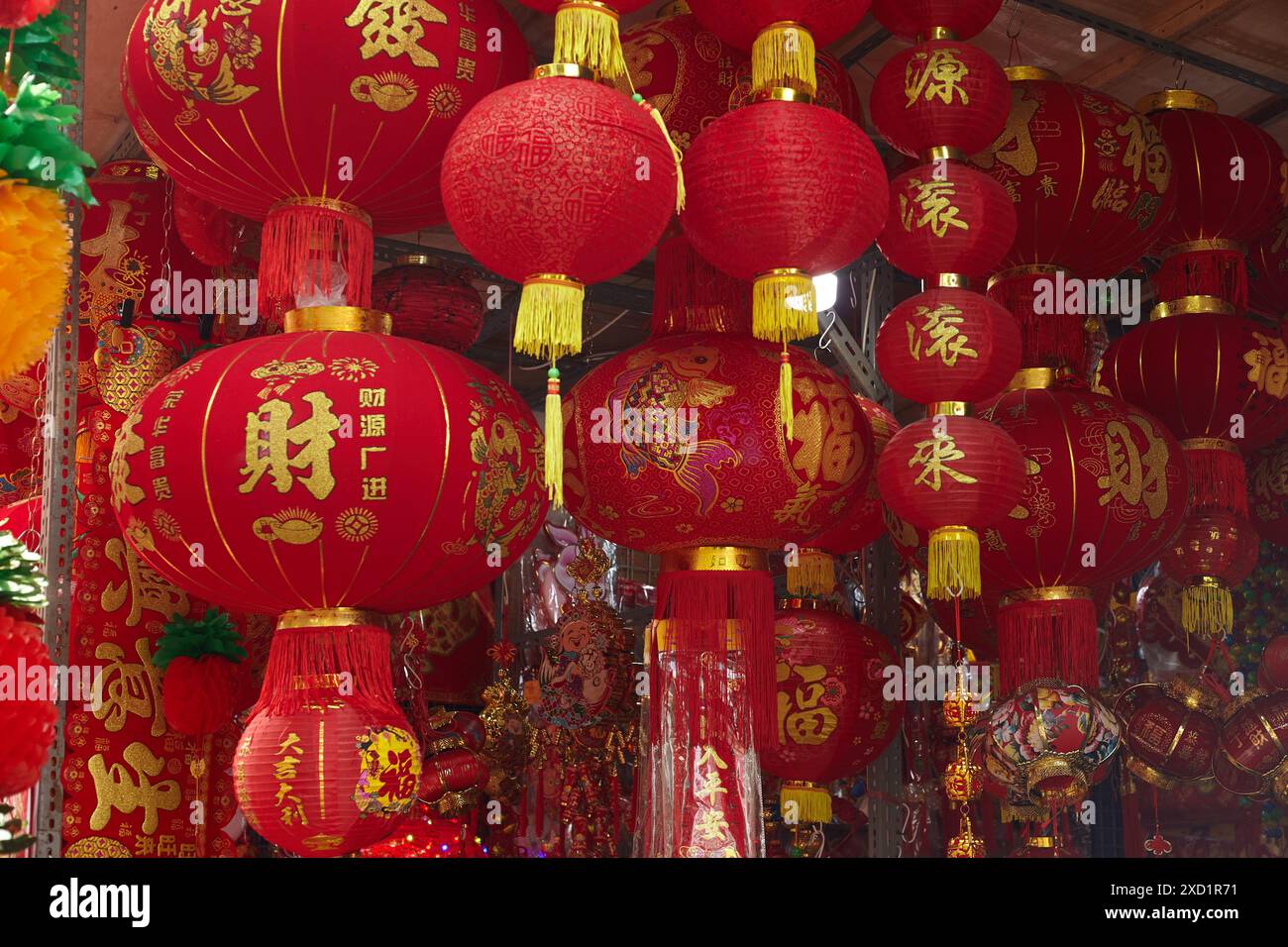 Chinese New Year decorations and lanterns in the market containing ...