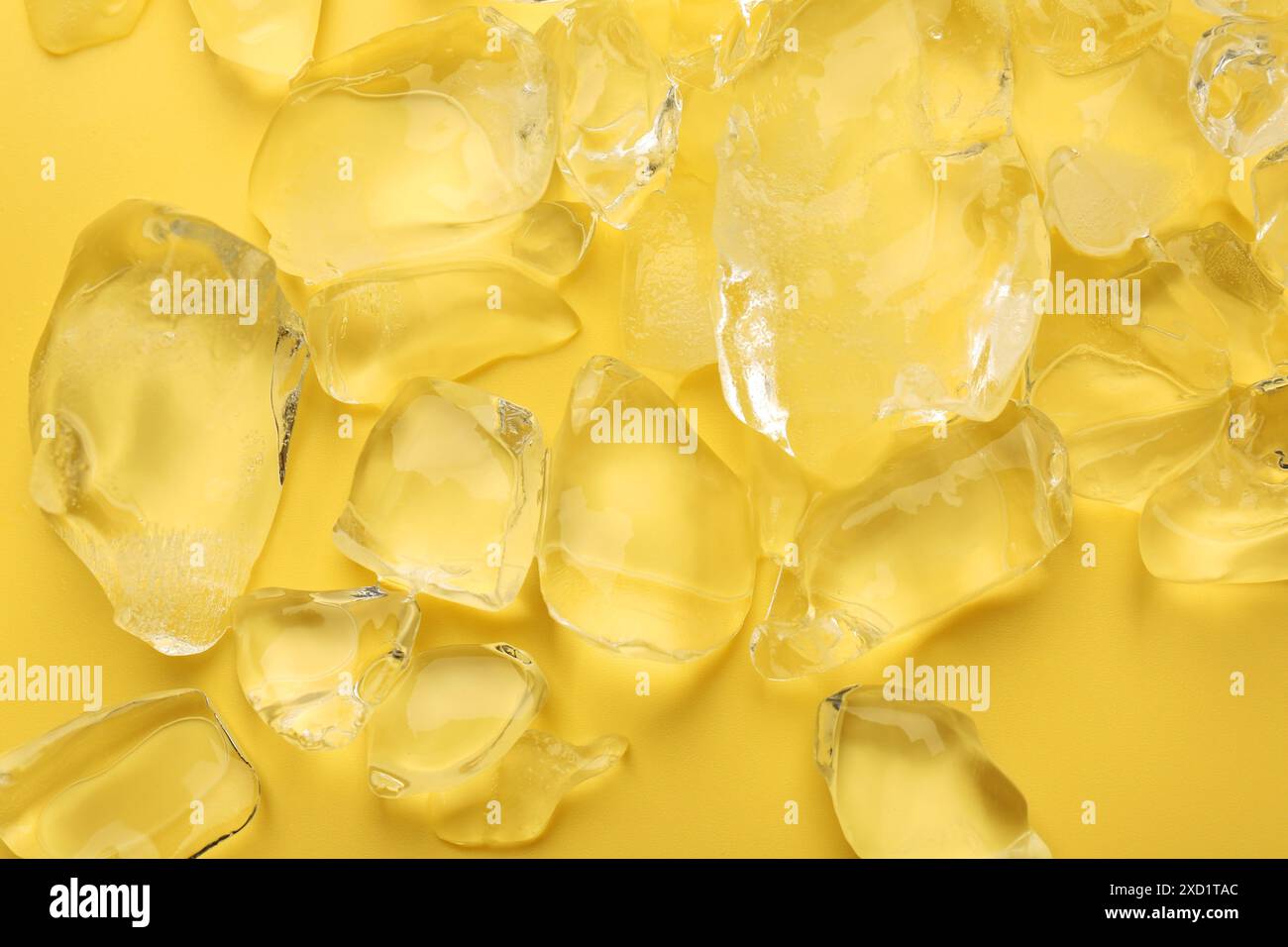 Pieces of crushed ice on yellow background, top view Stock Photo - Alamy