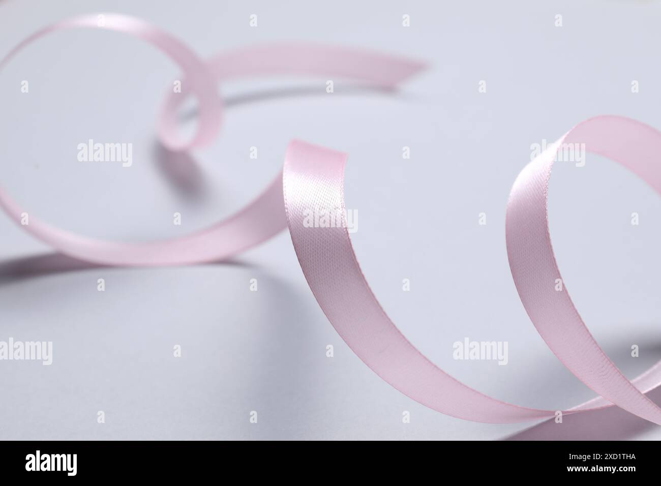 One beautiful pink ribbon on white background Stock Photo - Alamy