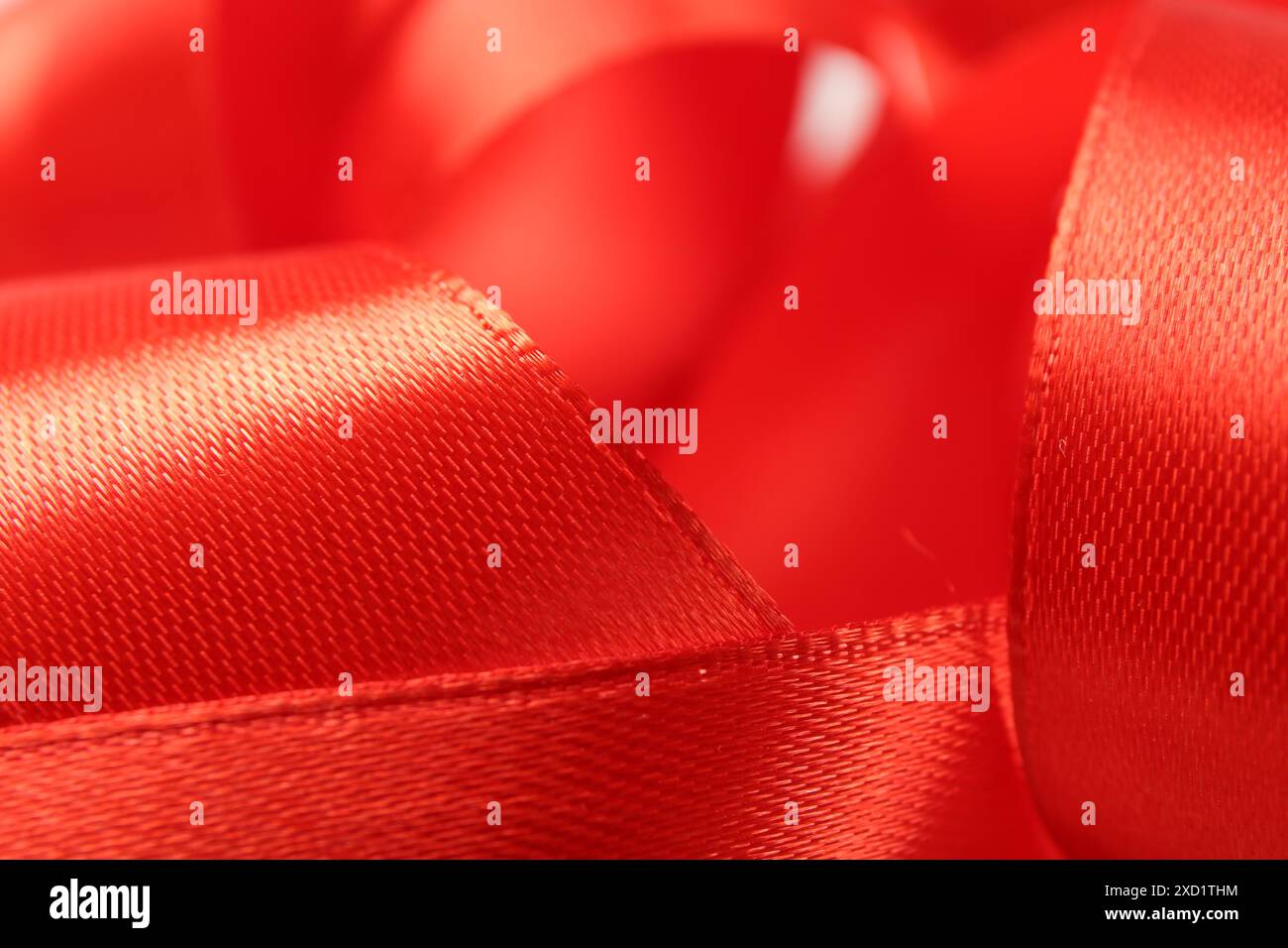 Beautiful red ribbon as background, closeup view Stock Photo - Alamy
