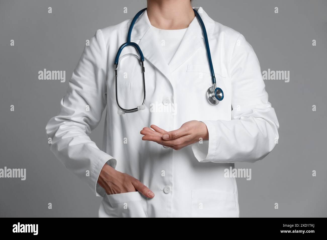 Woman medic holding something hi-res stock photography and images - Alamy