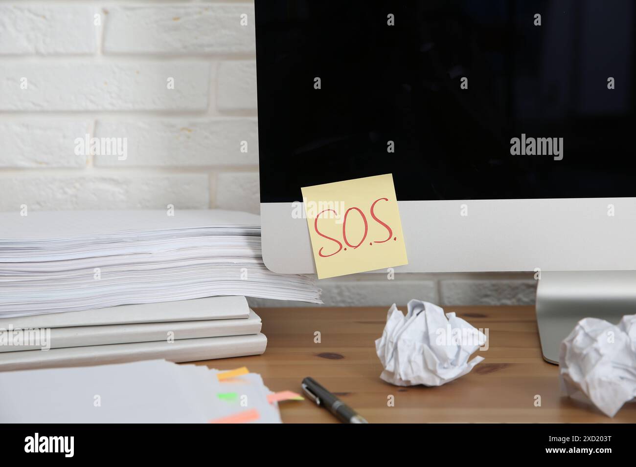 Note with word SOS and stationery on computer at workplace Stock Photo ...