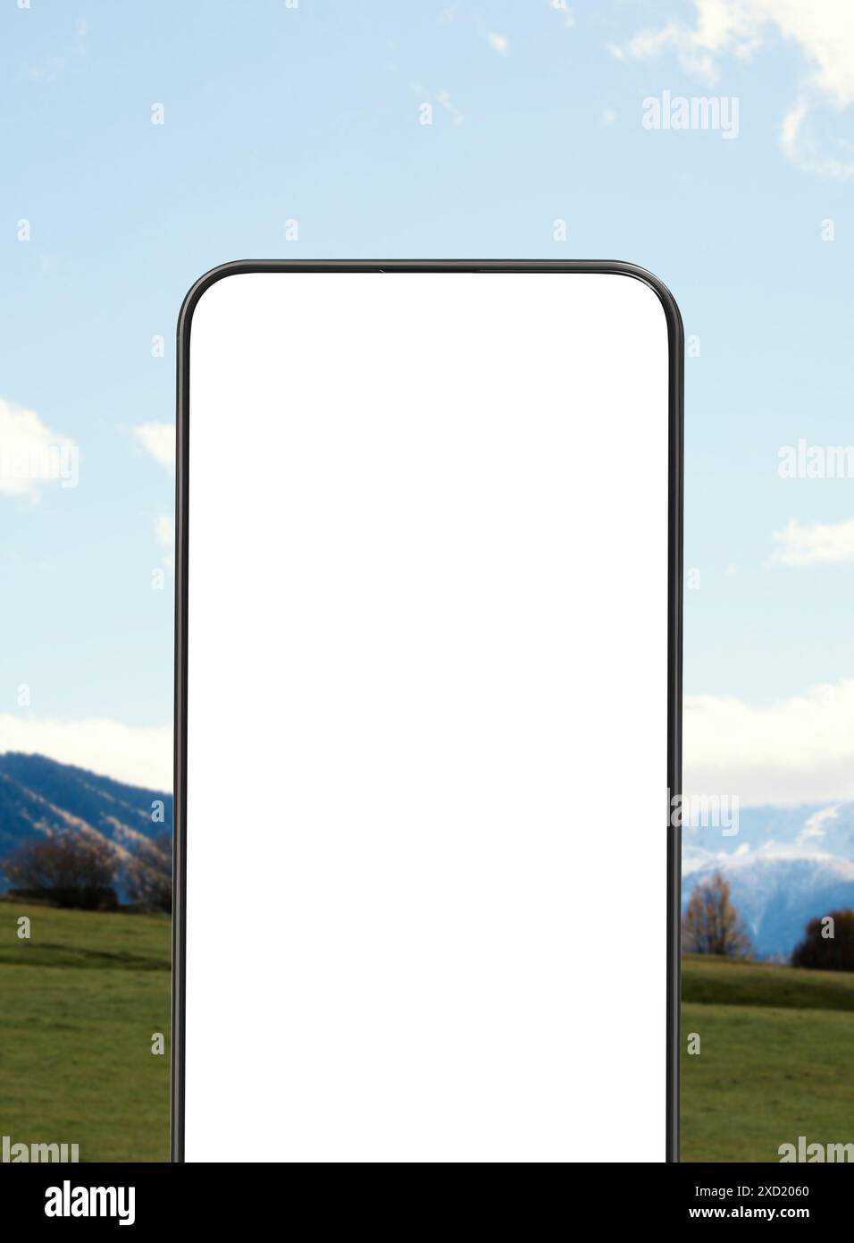 Mobile phone with empty screen against mountain landscape. Space for ...