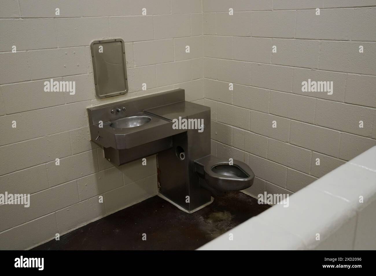 A toilet is pictured in a group holding cell during a media tour of the ...
