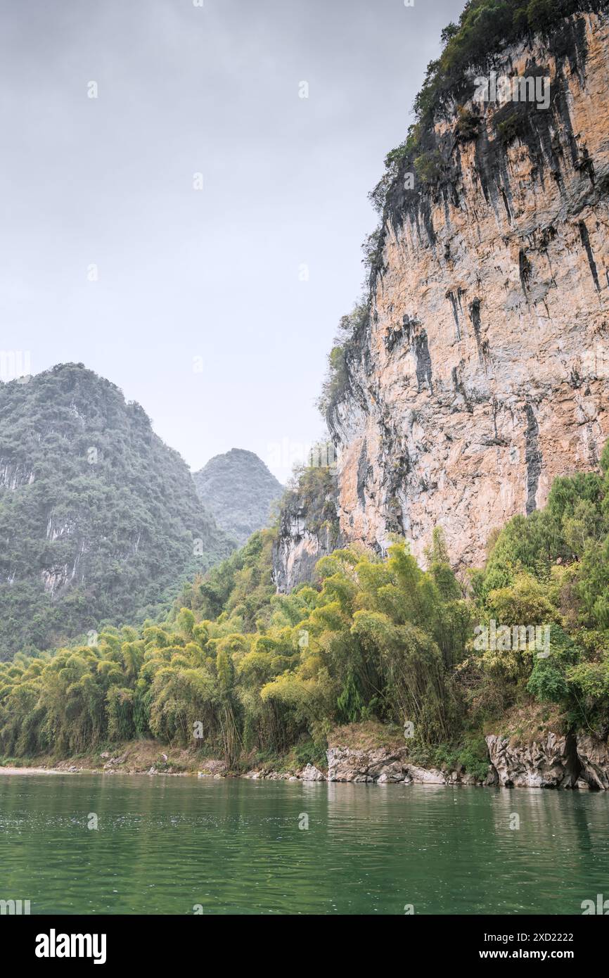 Bamboo and the limestone mountains at the Li river around Xing Ping ...