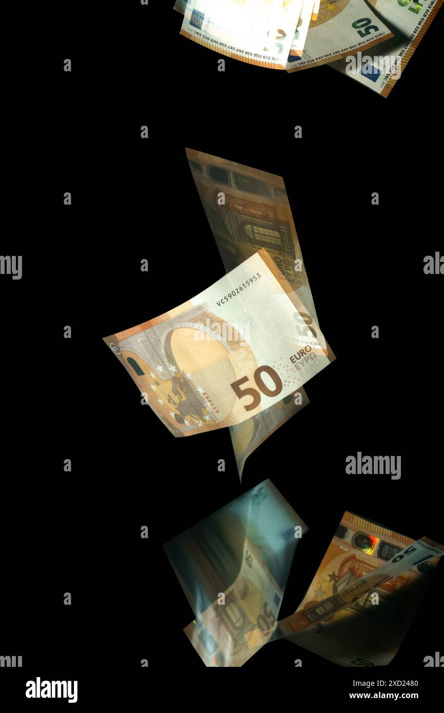 Stroboscopic photo of falling euro banknotes on dark background Stock ...