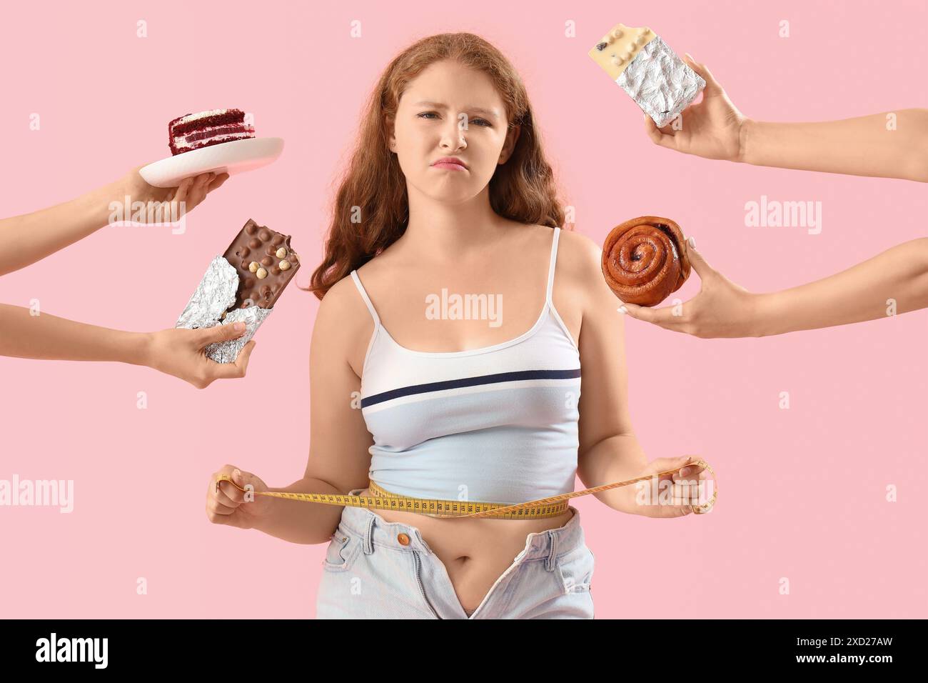 Young woman in tight shorts measuring her waist and hands with ...