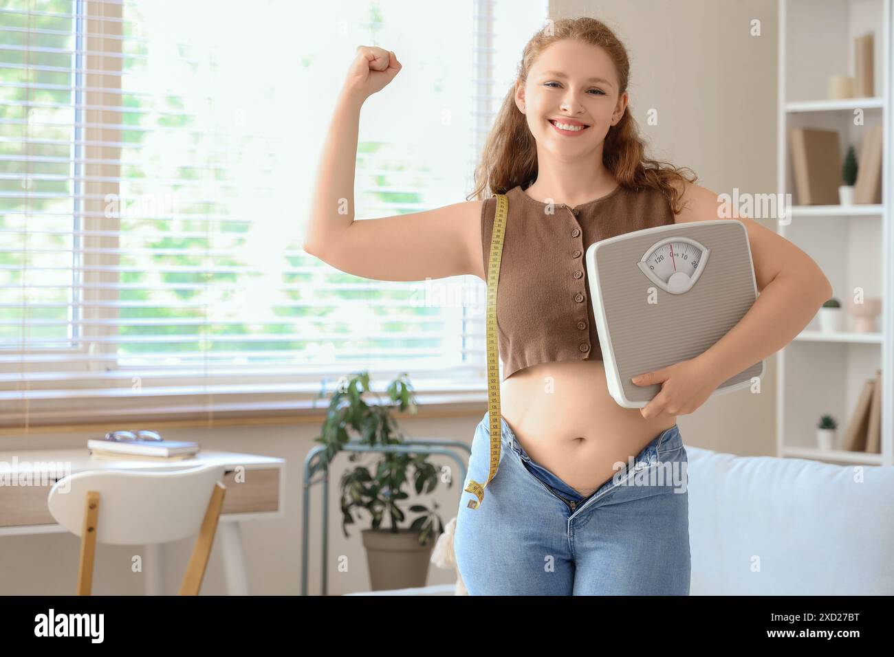 Obese woman scales happy hi-res stock photography and images - Alamy