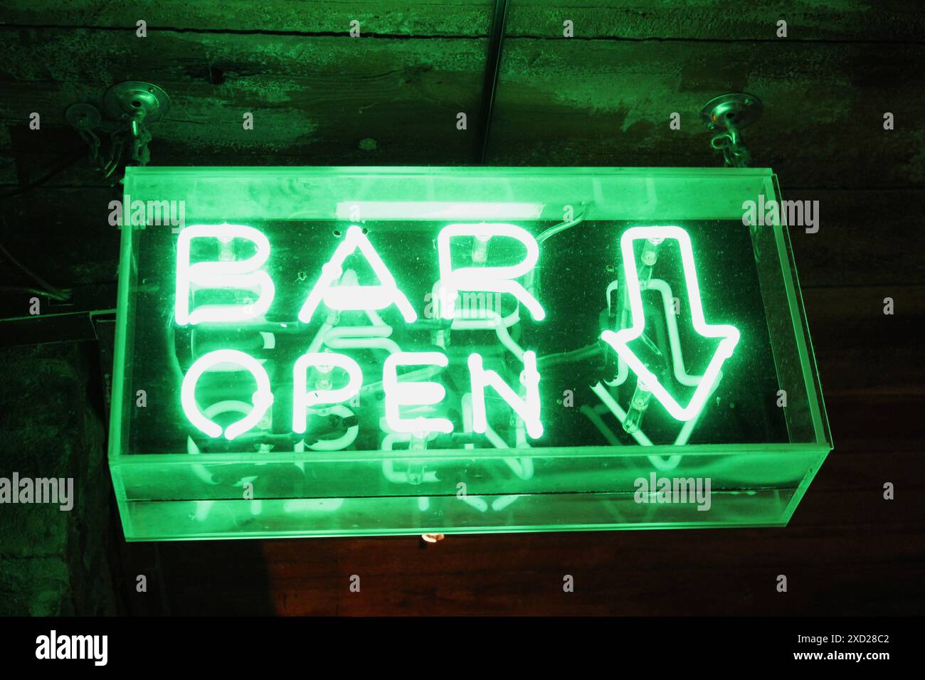 A green glowing neon sign indicating the bar is open Stock Photo - Alamy