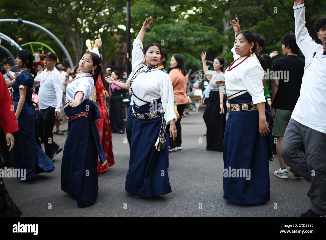 New York, USA. 19th June, 2024. Members of the Tibetan community gather ...
