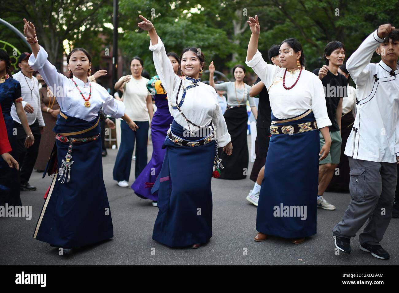 New York, USA. 19th June, 2024. Members of the Tibetan community gather ...