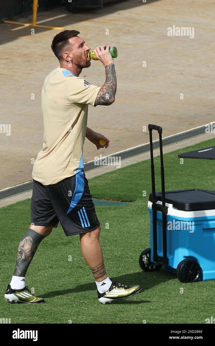 Argentina's forward Lionel Messi drinks during a training session ahead ...
