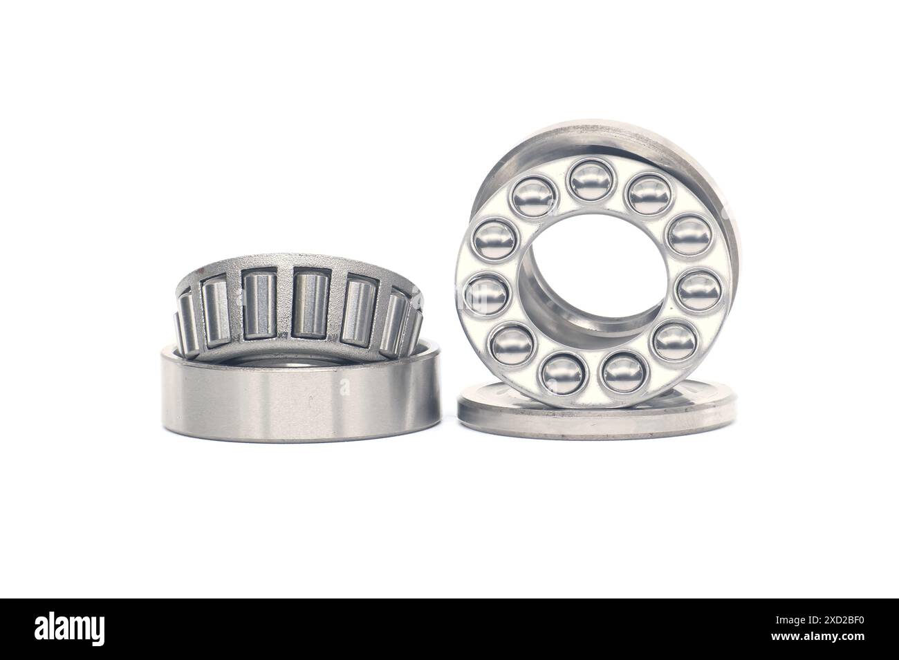 Single row tapered roller bearings and thrust ball bearings isolated on ...