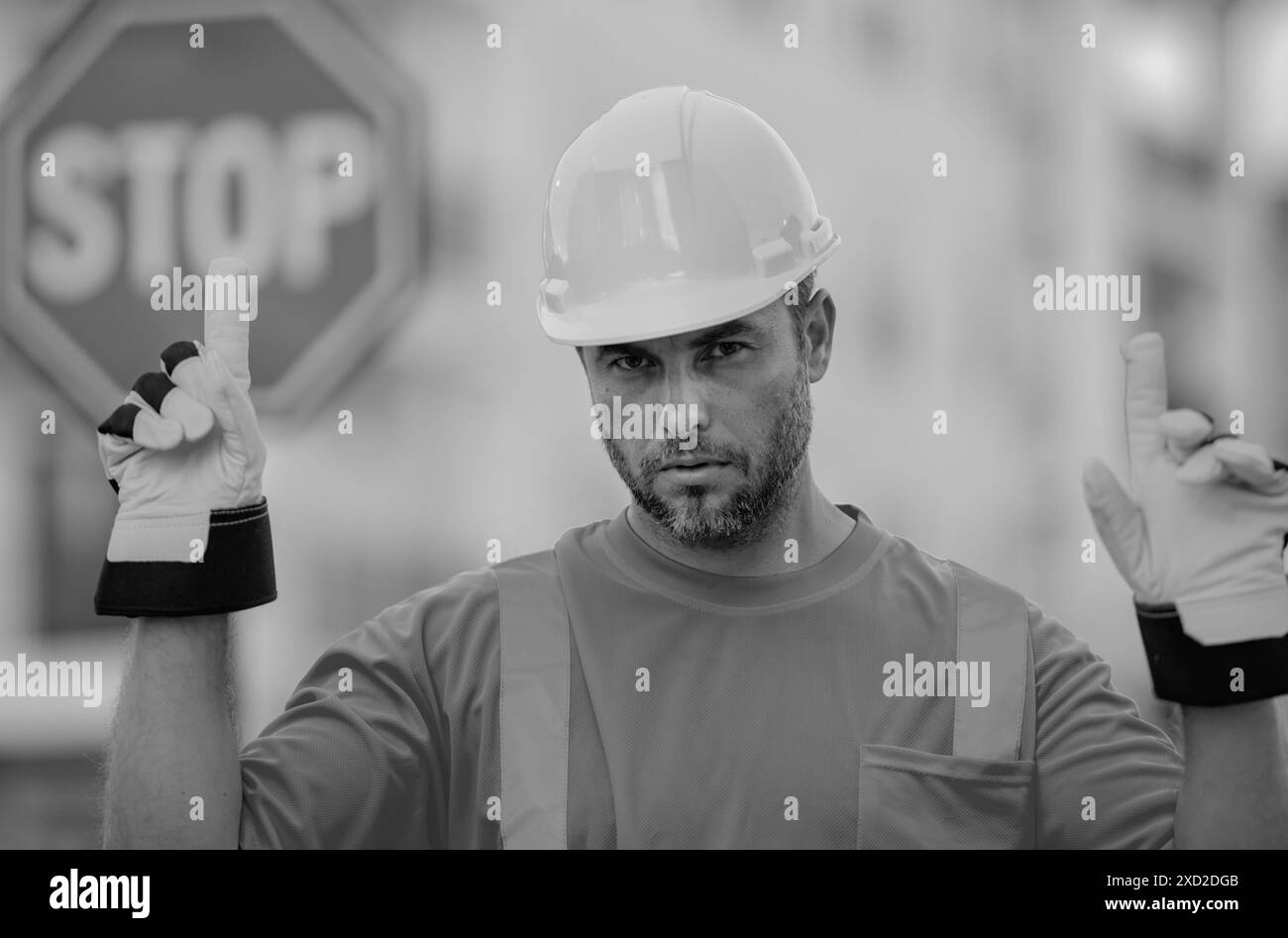 Worker in uniform gesturing stop. Worker builder in hard hat with stop ...