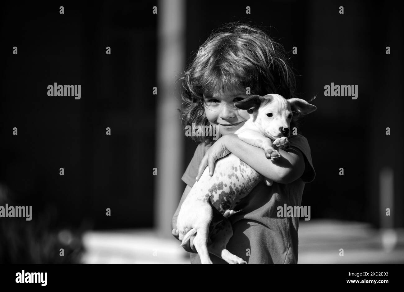 Happy kid boy hugging a dog. Cute child and puppy playing outside Stock ...