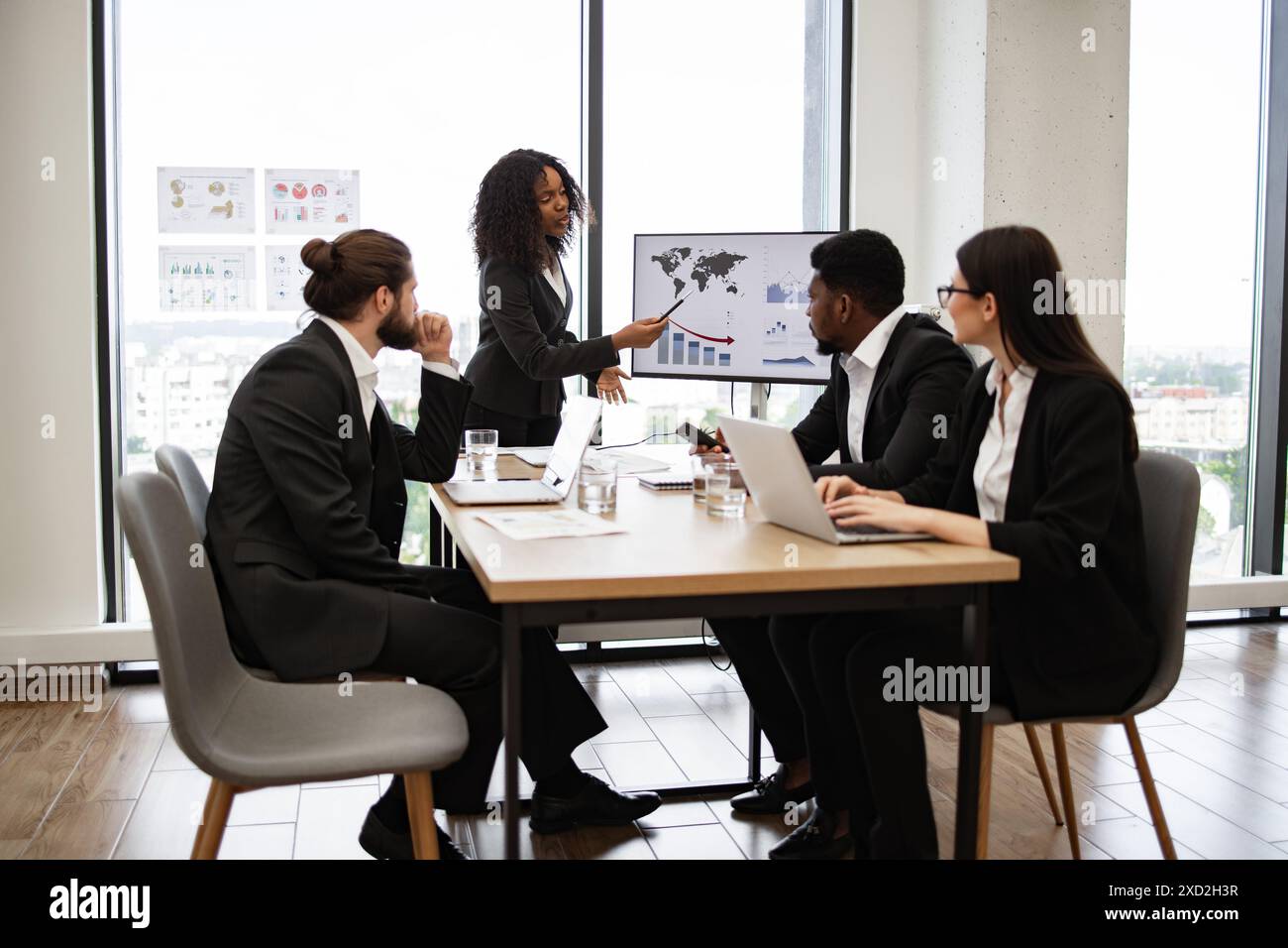 Colleagues discussing business strategy during office meeting Stock ...