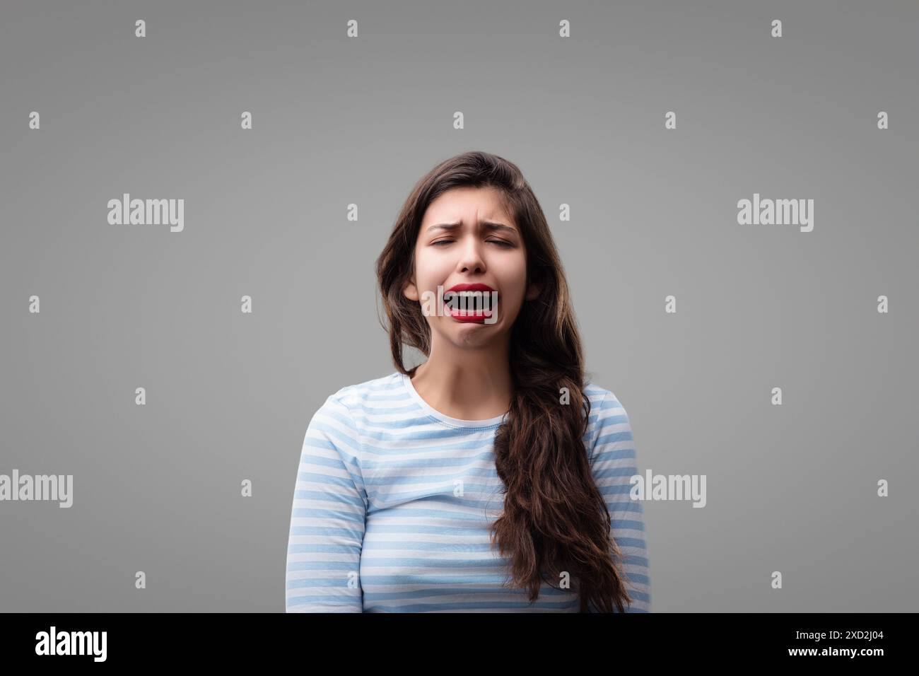 Young woman is experiencing intense sadness and despair, expressing her ...