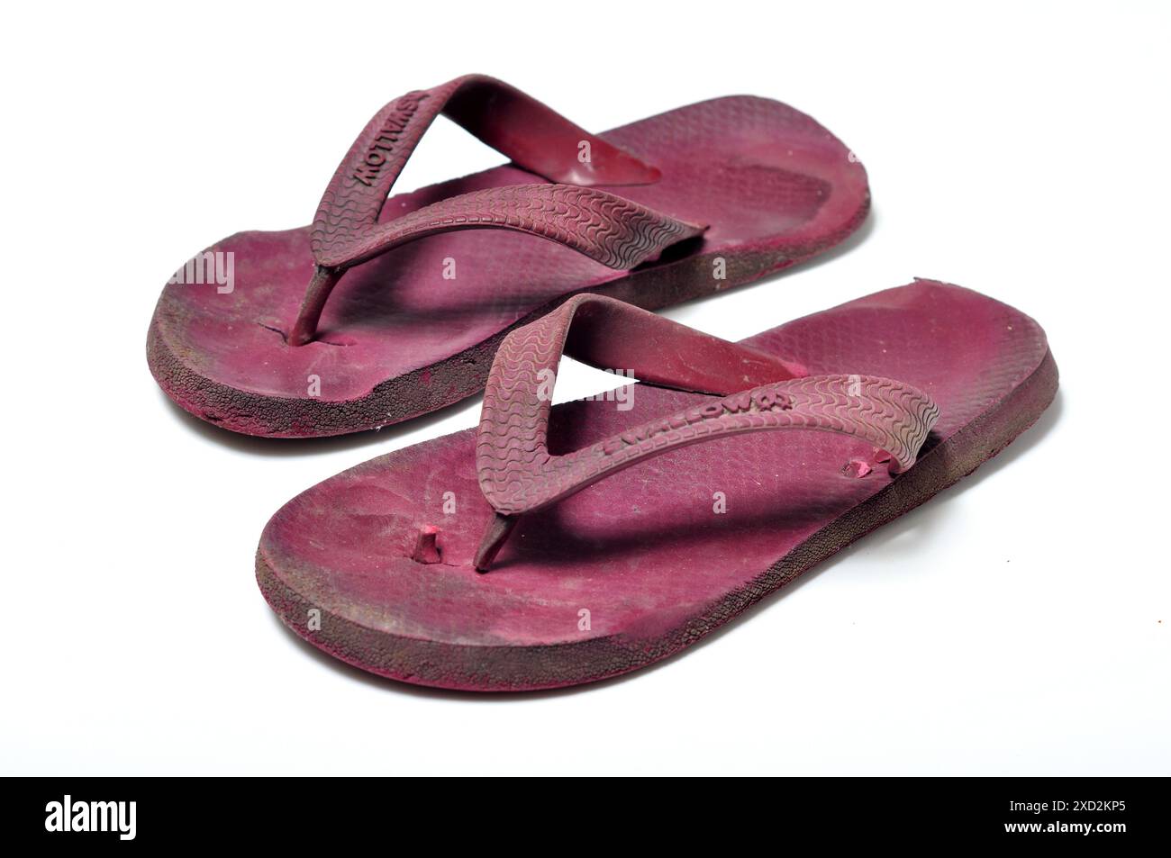 Worn and ugly flip flops on white background Stock Photo - Alamy