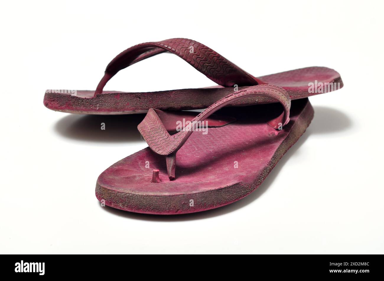 Worn and ugly flip flops on white background Stock Photo - Alamy