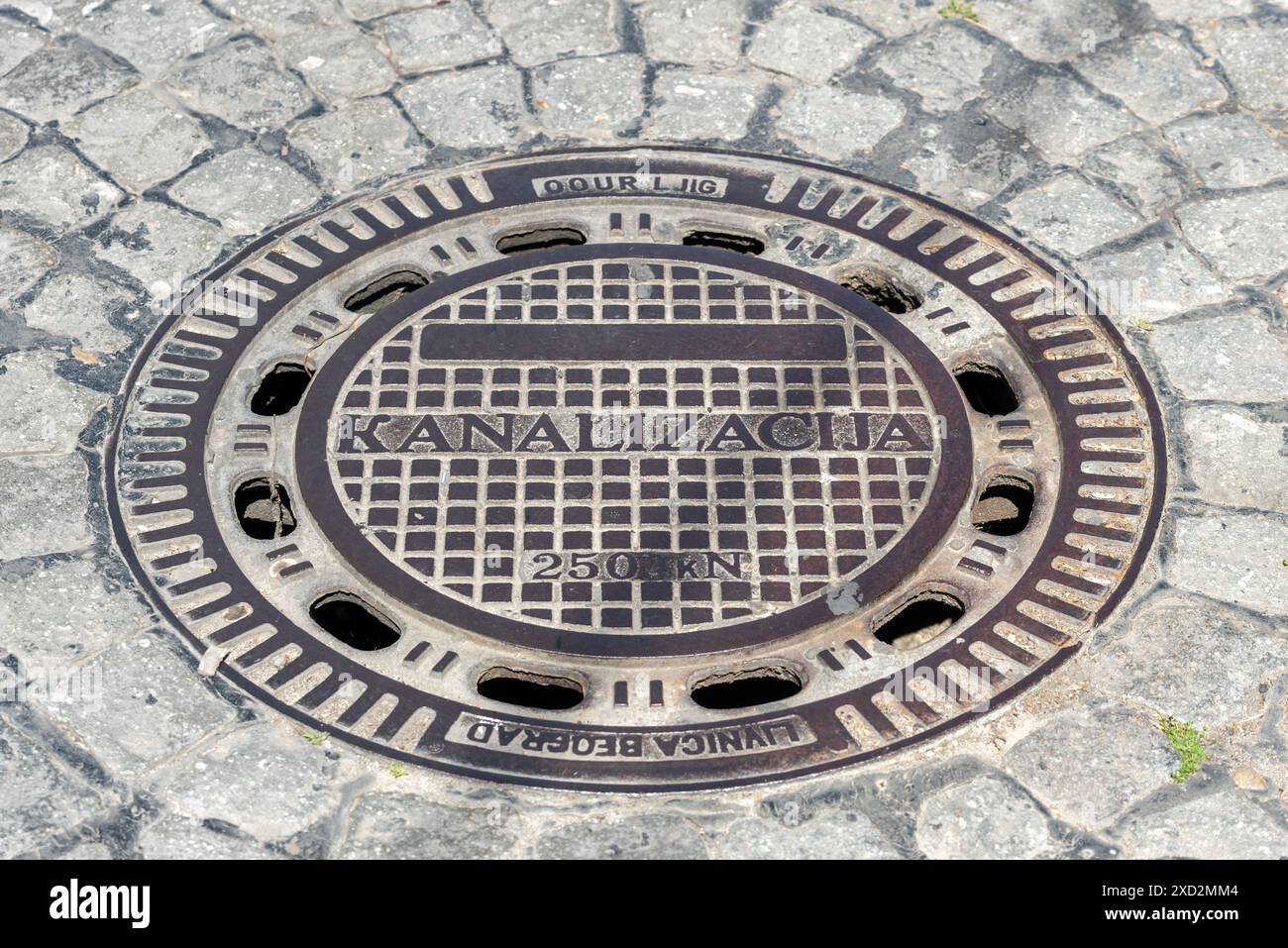 Ornate and detailed man hole cover for sewage in the city of Belgrade ...