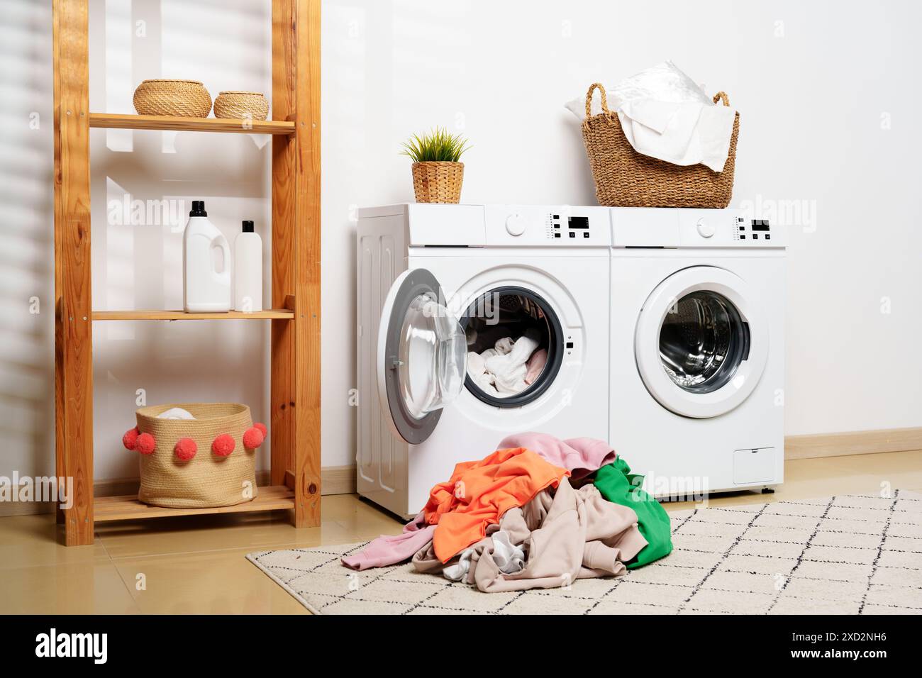 White Laundry Appliances With Colorful Clothes Overflowing From Washing ...