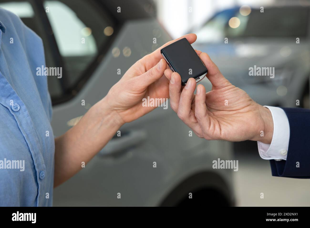 Close up picture of hands passing the car key Stock Photo - Alamy