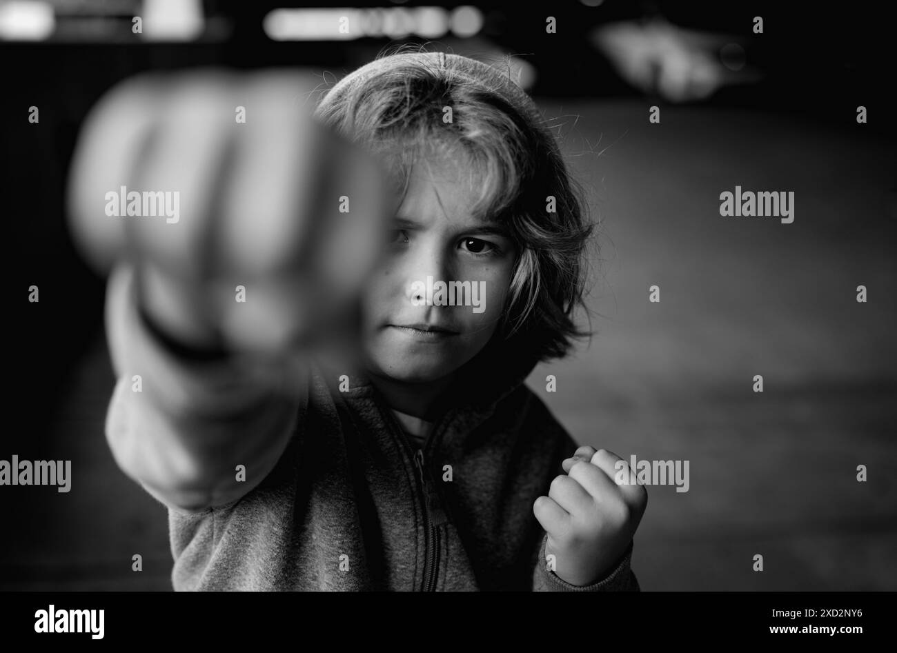 Kid boy in hoodie fighting. Little kid boy fighting outside. Angry ...