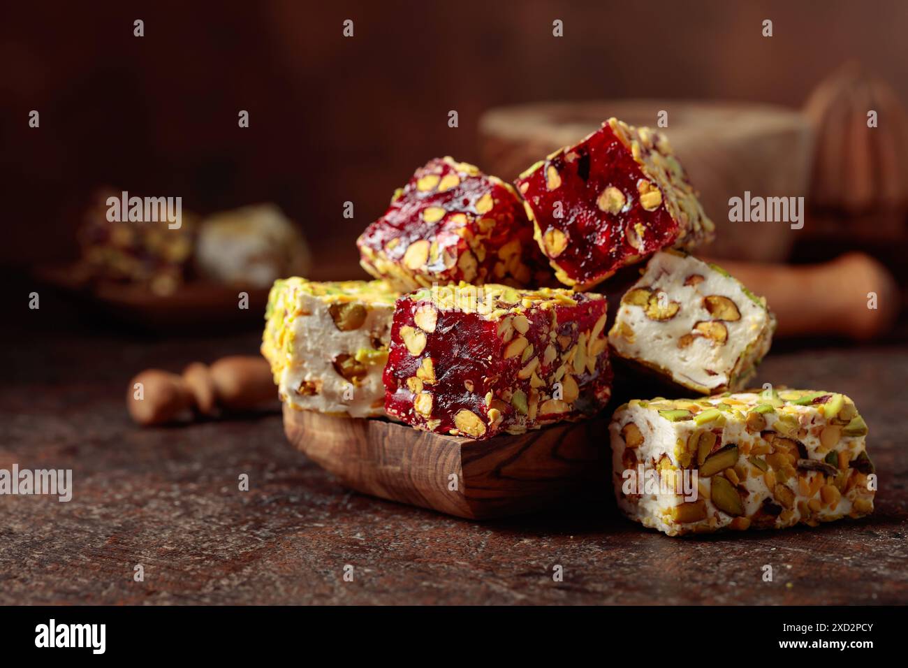Traditional Turkish delight on an old brown table with wooden kitchen ...