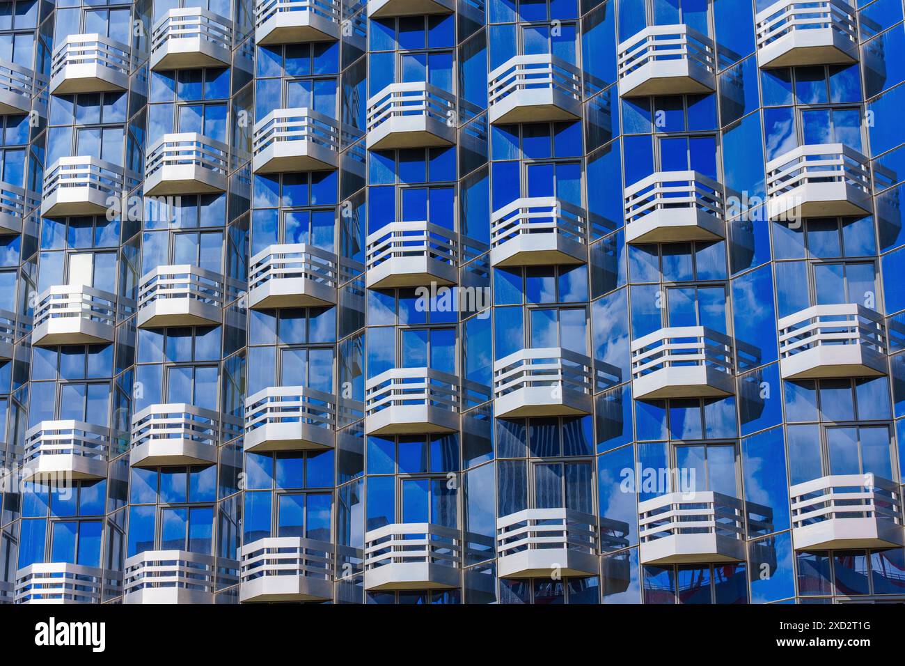 Pattern of repeating steel balconies adorning the facade of a ...