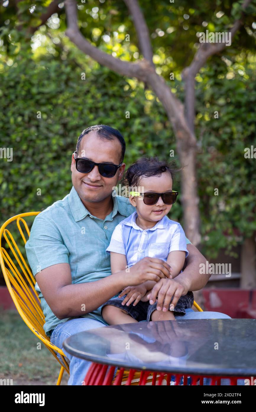 indian father and toddler son cozy moments and facial expression at ...