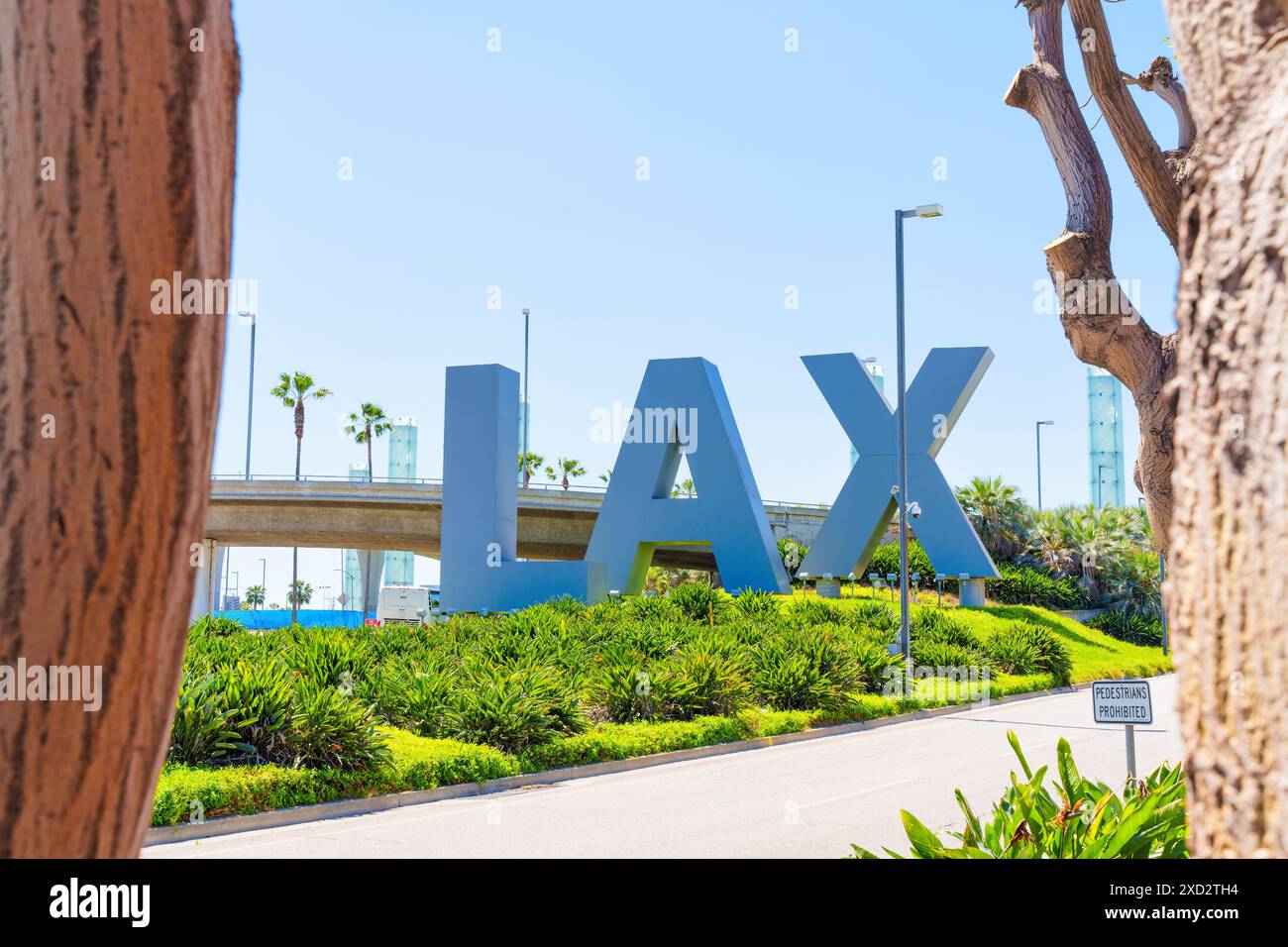 Los Angeles, California - April 8, 2024: LAX sign on a lush green lawn ...