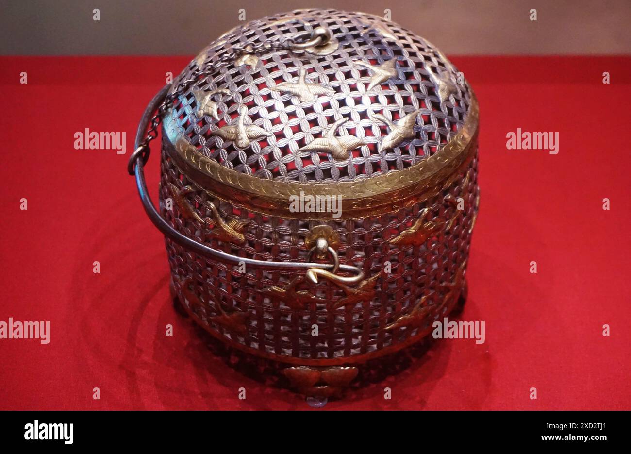 HANGZHOU, CHINA - JUNE 20, 2024 - A Tang Dynasty gilt Feihong ball ...