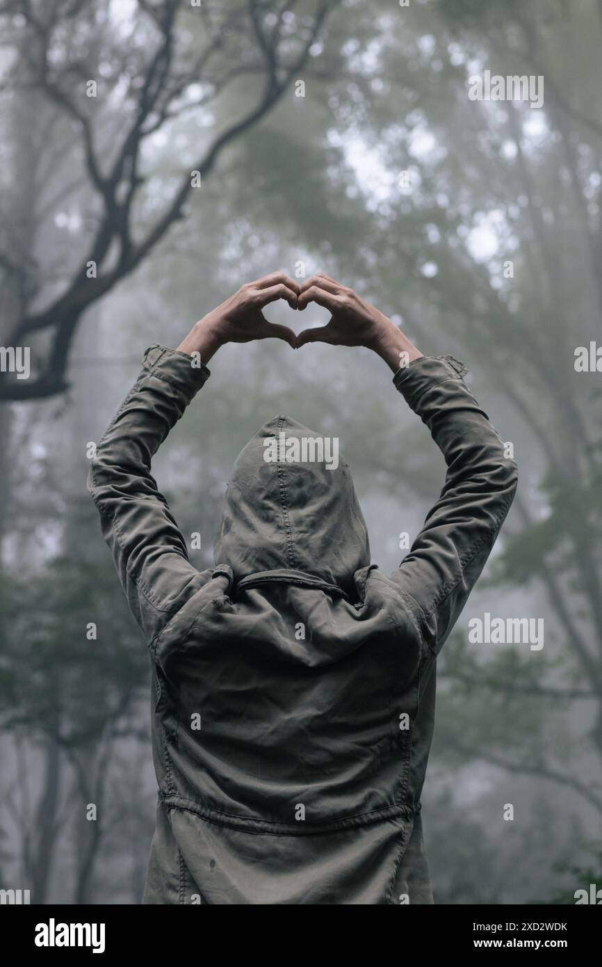 A young man uses sign language to express his love and friendship to ...