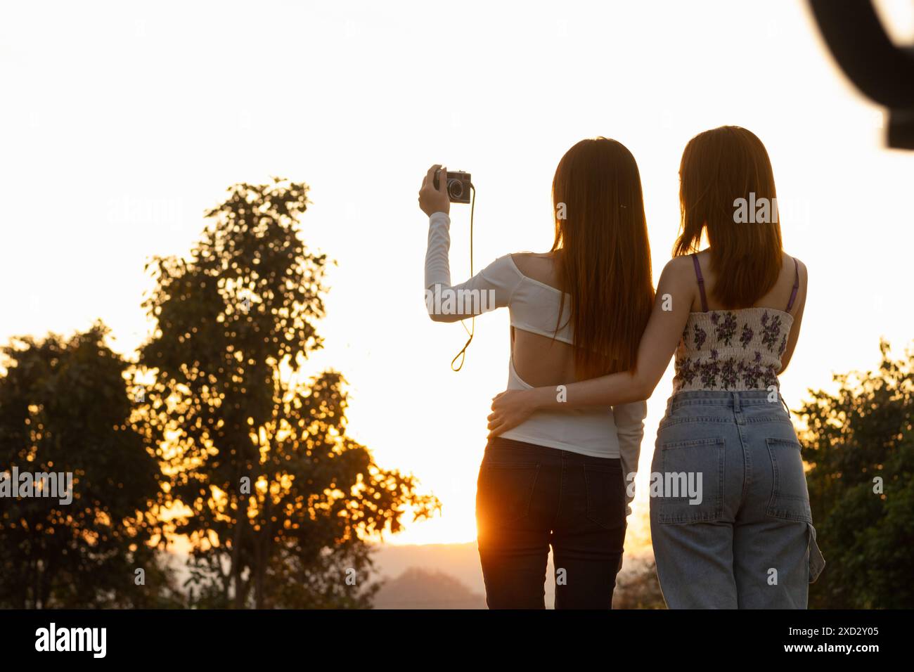 silhouette of happy young couple on observation deck against the ...