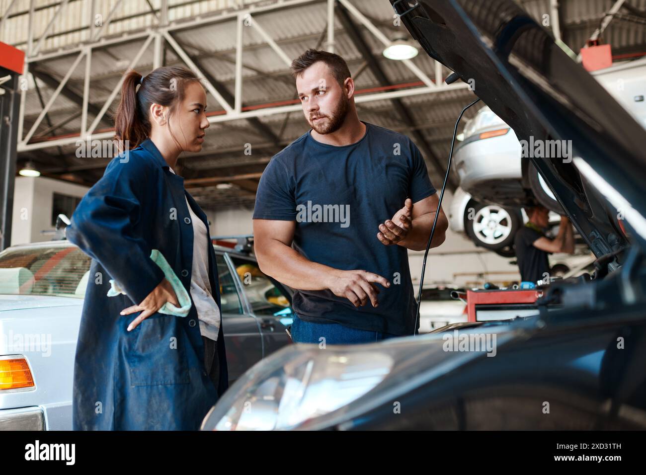 People, mechanic and car engine with teamwork, advice and inspection ...
