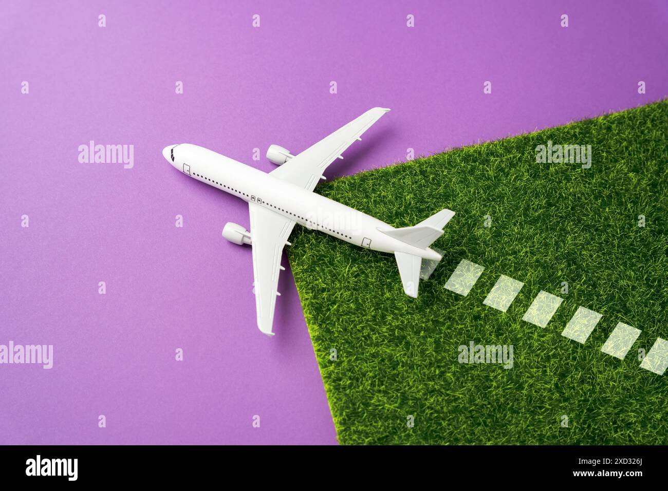 Ecology in aviation. A airliner plane spreads green grass. Transition ...