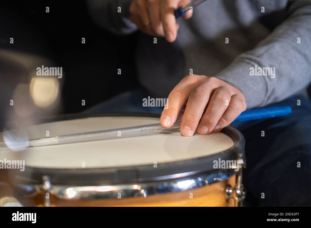 Drummer behind the drums in the studio, at a concert. Professional drum ...